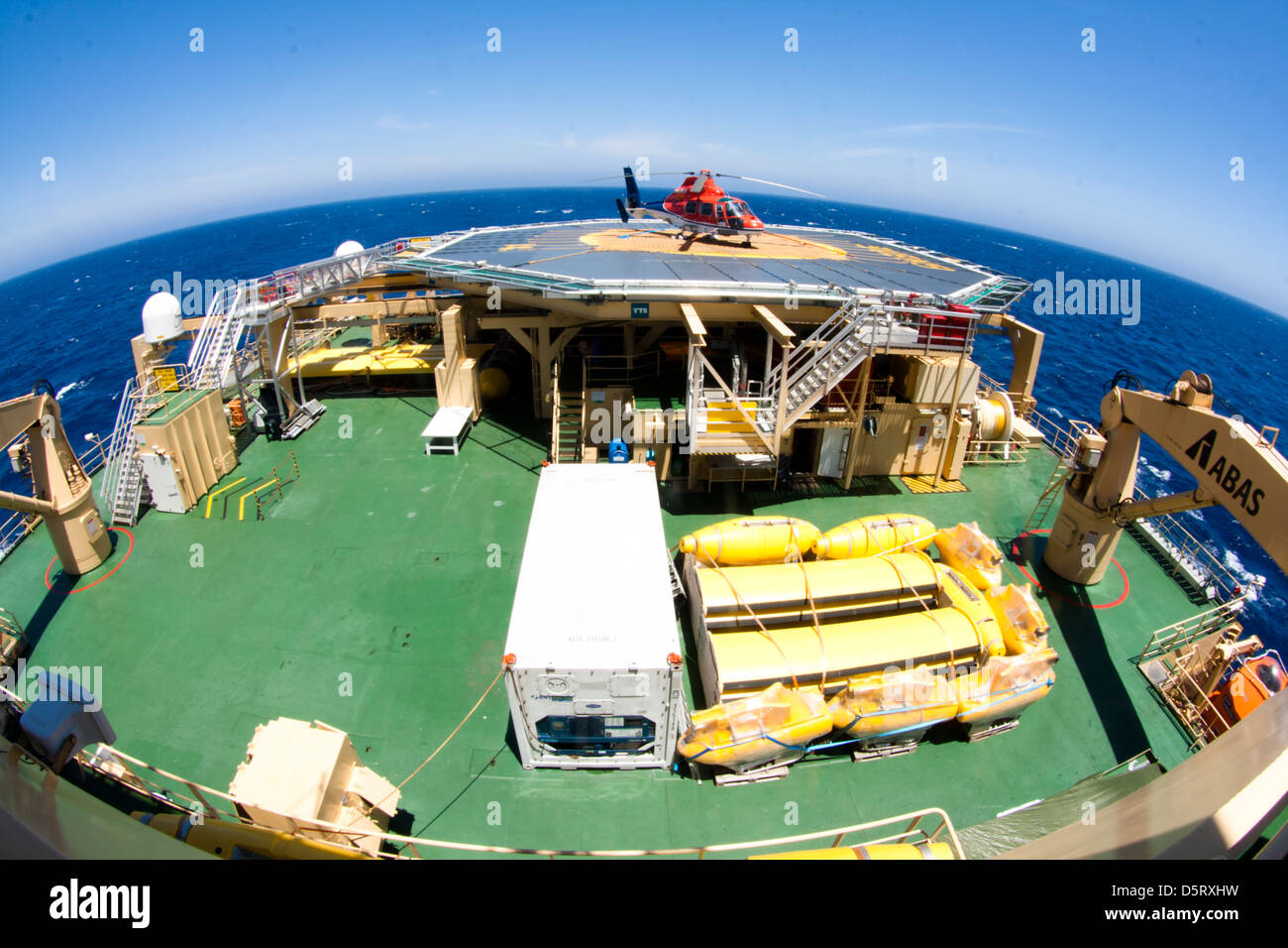helicopter landed in the landing deck of seismic vessel Ramform ...