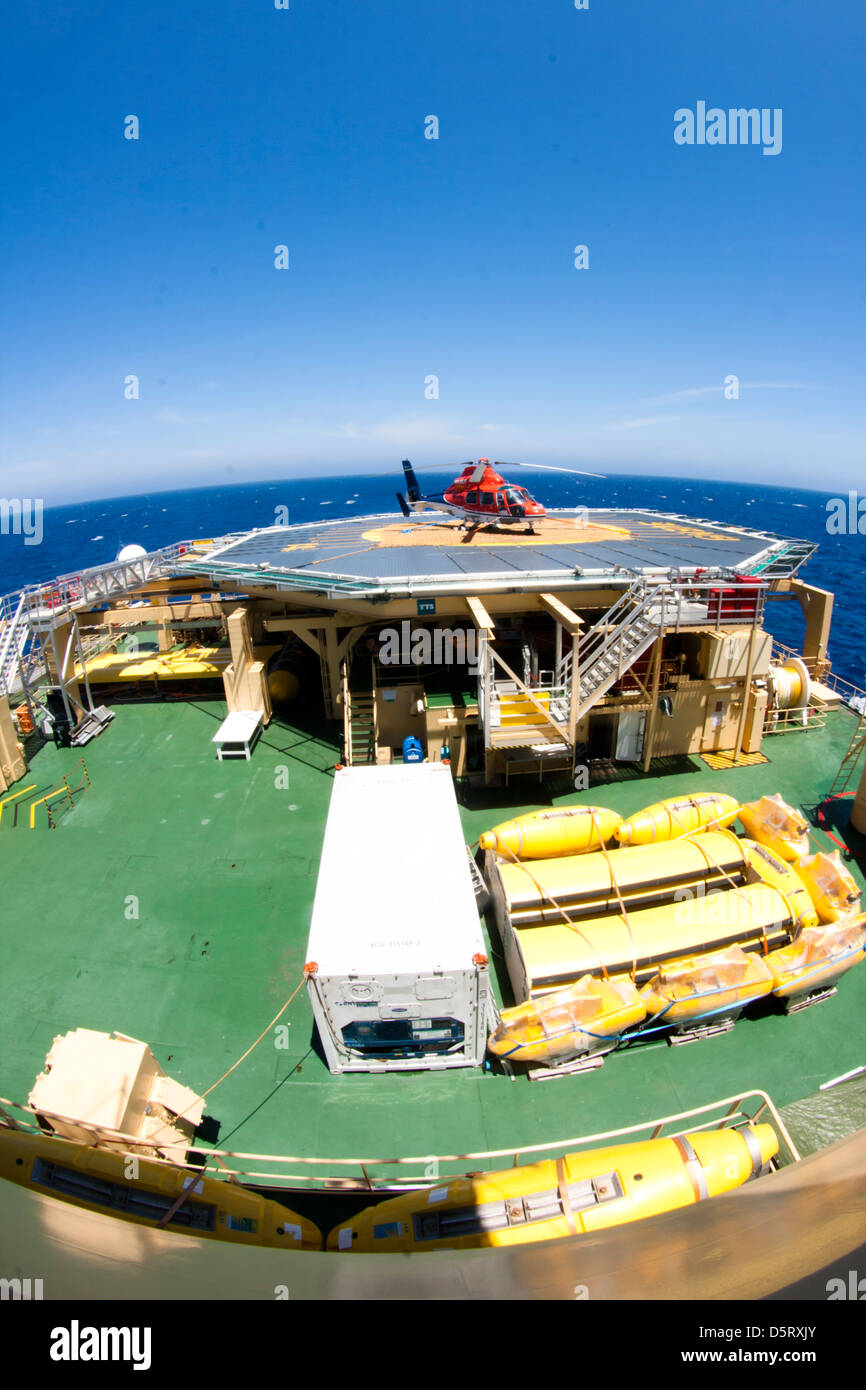 helicopter landed in the landing deck of seismic vessel Ramform ...