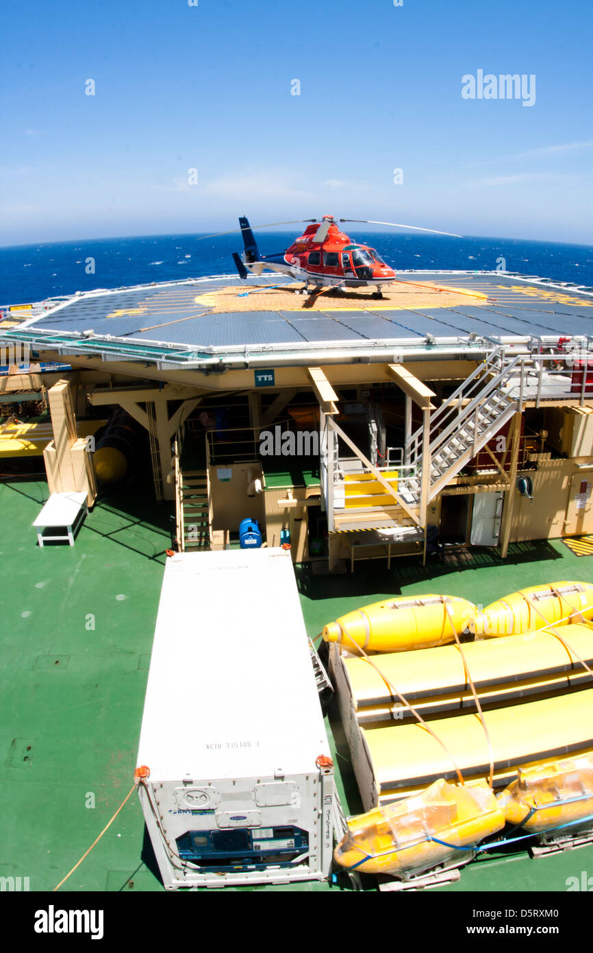 helicopter landed in the landing deck of seismic vessel Ramform ...