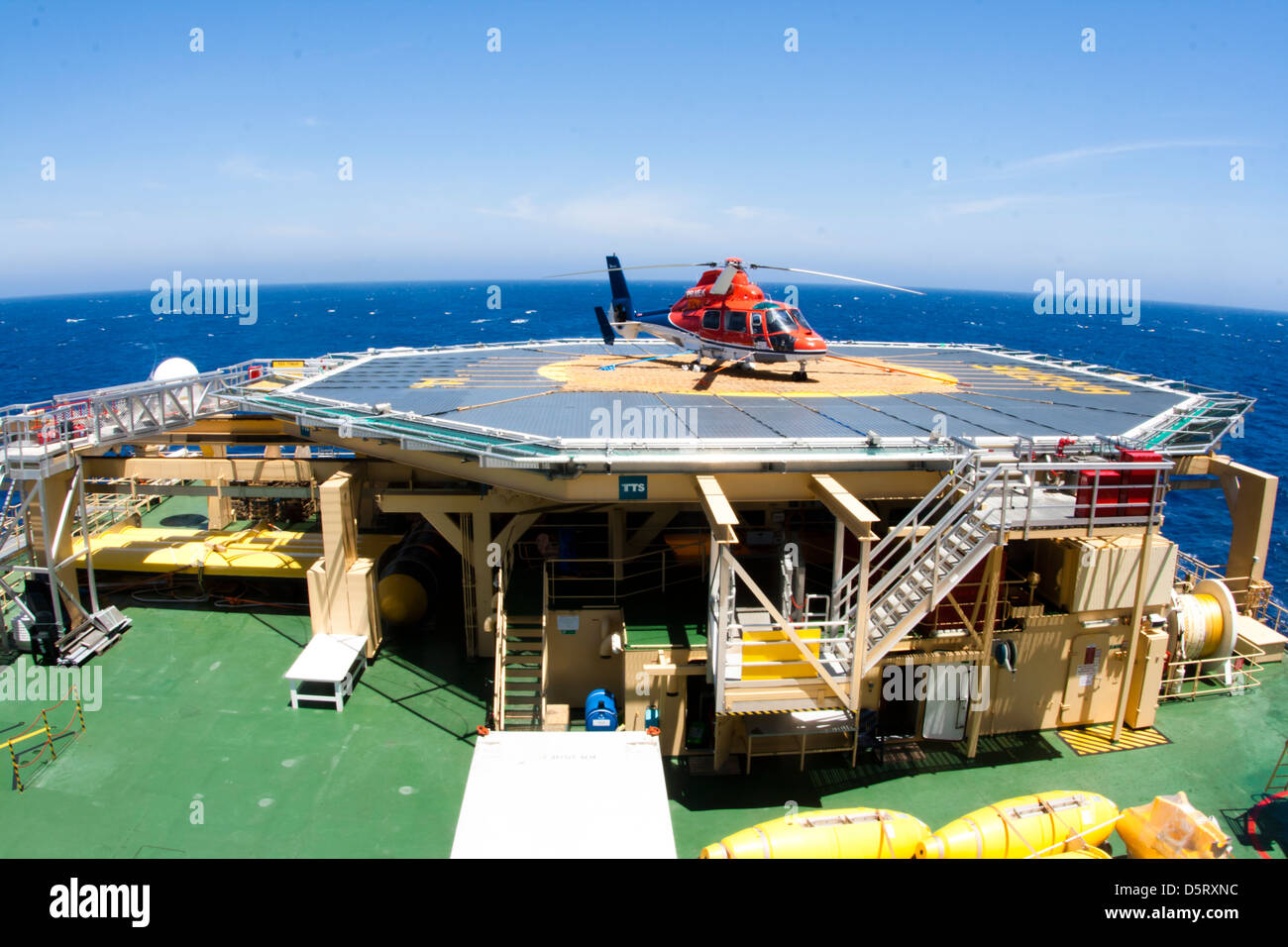 helicopter landed in the landing deck of seismic vessel Ramform ...