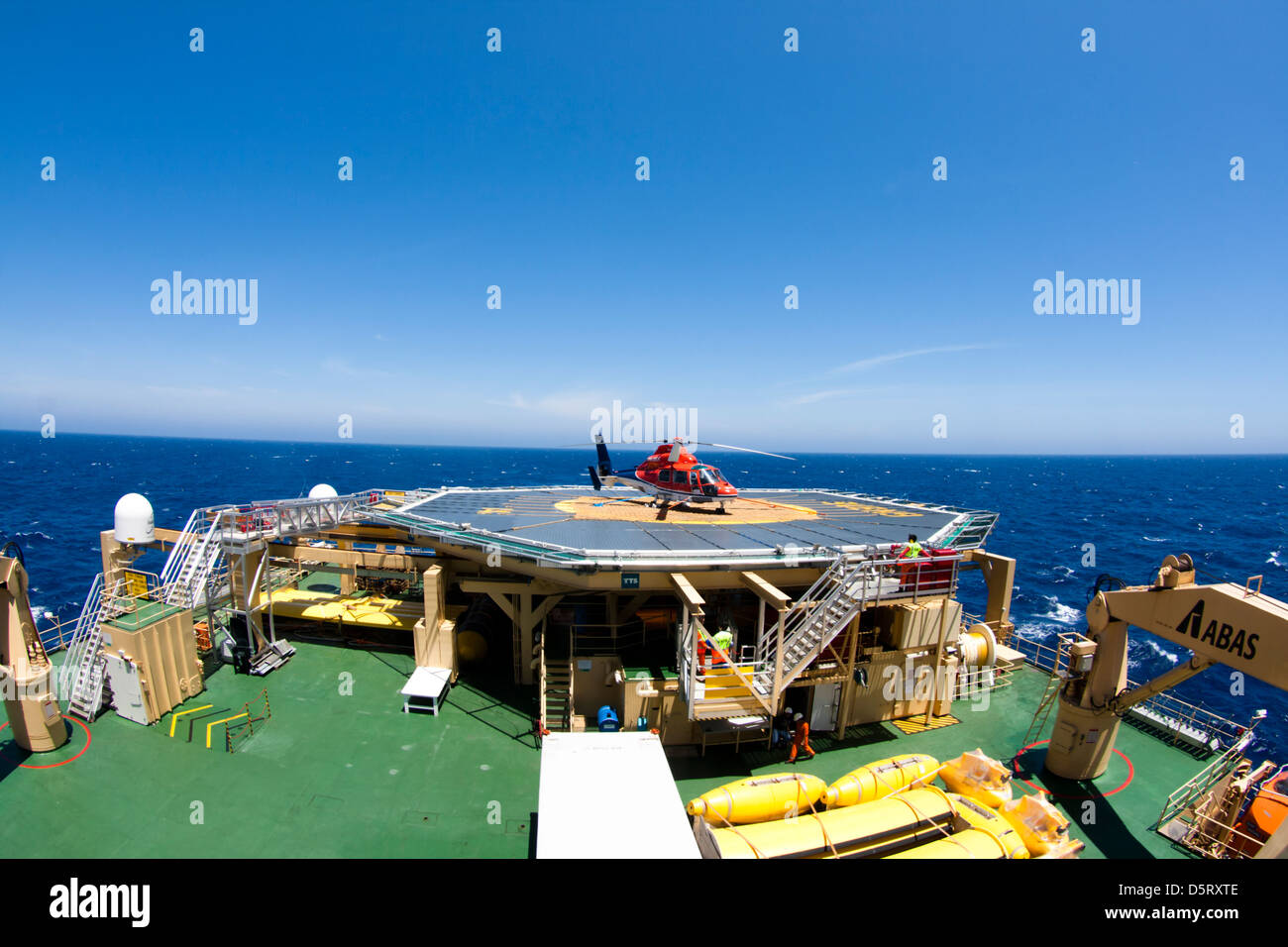helicopter landed in the landing deck of seismic vessel Ramform ...