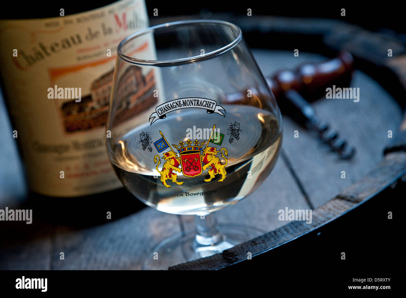CHASSAGNE-MONTRACHET French wine tasting tour in cellar with glass and ...