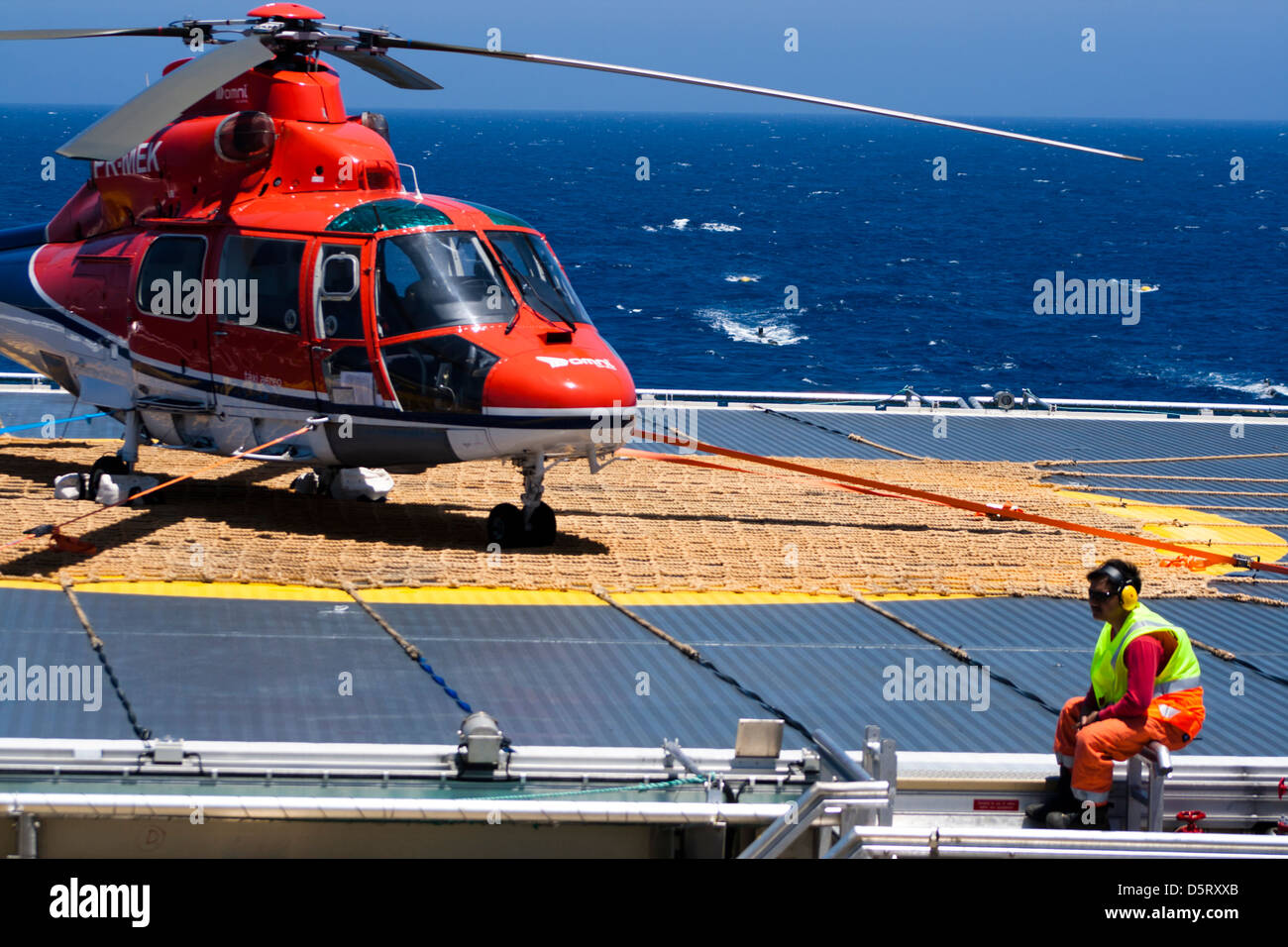 helicopter landed in the landing deck of seismic vessel Ramform ...