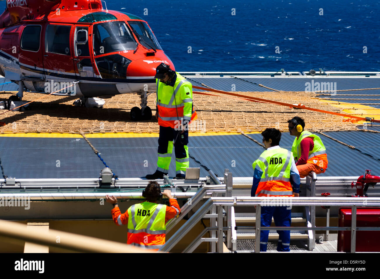 helicopter landed in the landing deck of seismic vessel Ramform ...