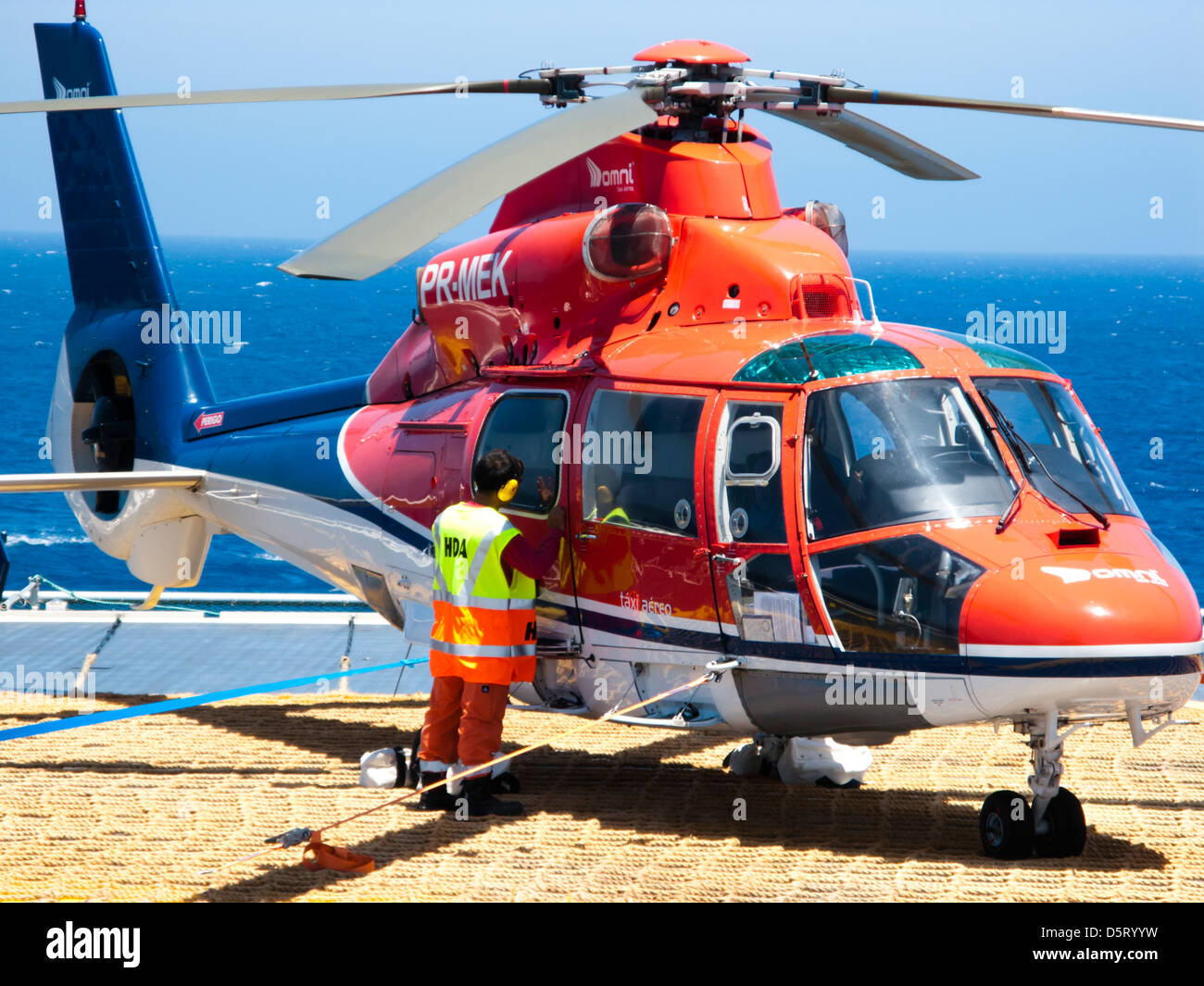 helicopter landed in the landing deck of seismic vessel Ramform ...