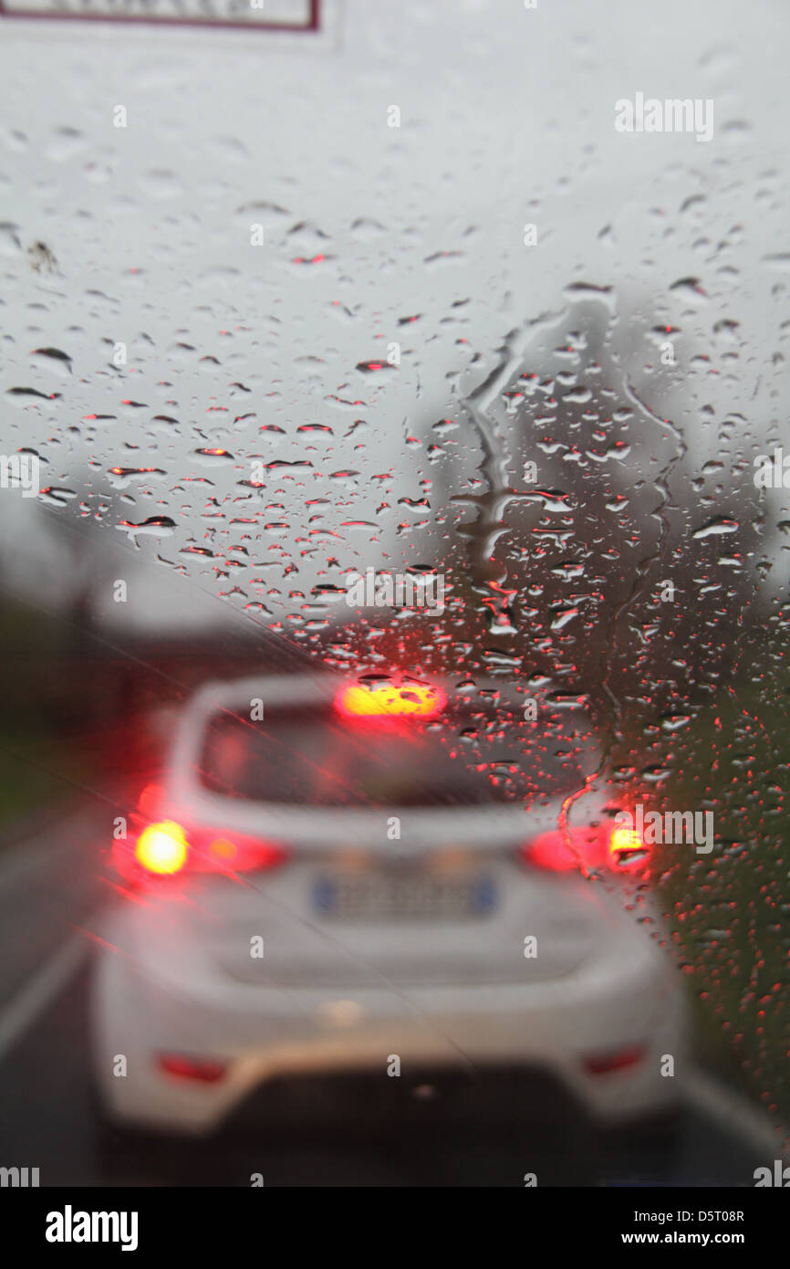 car lights in rain at night Stock Photo - Alamy