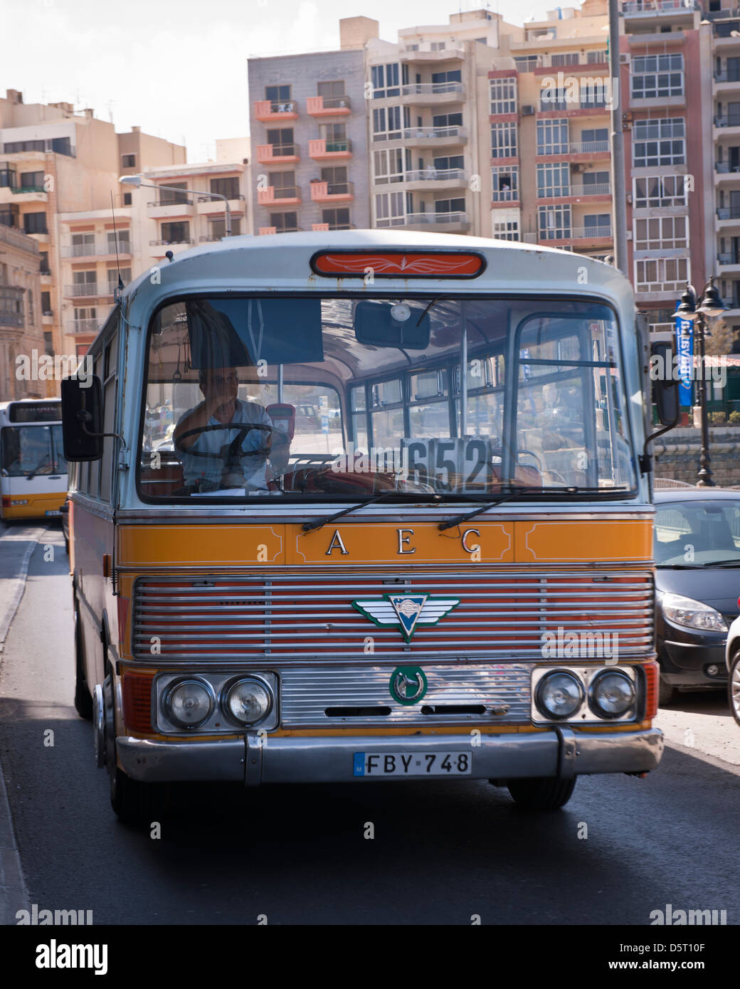 Local iconic yellow bus, Malta Stock Photo - Alamy