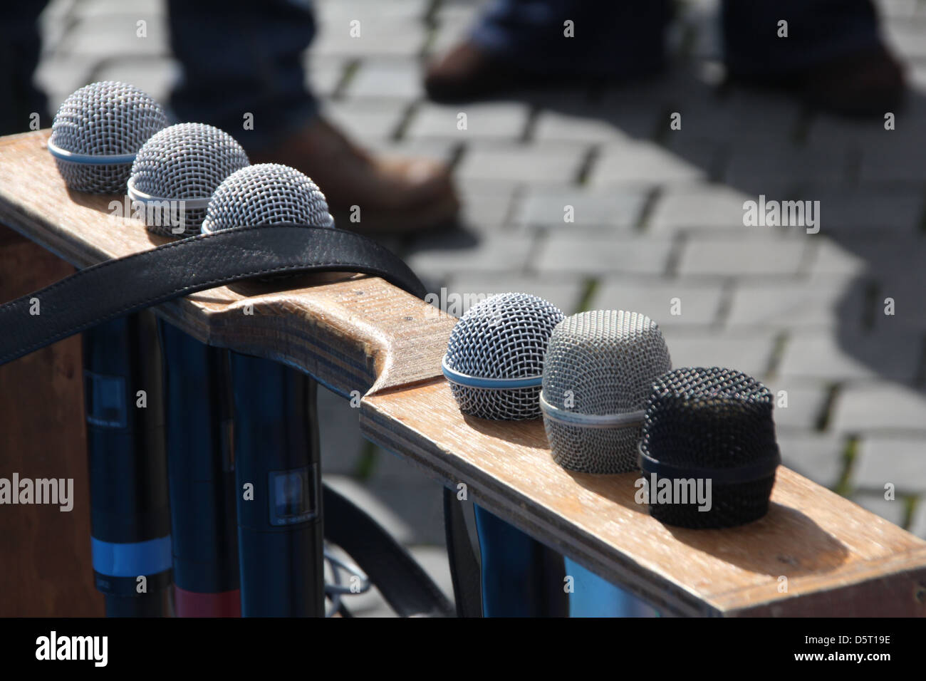 set of microphones on a stand at event Stock Photo - Alamy