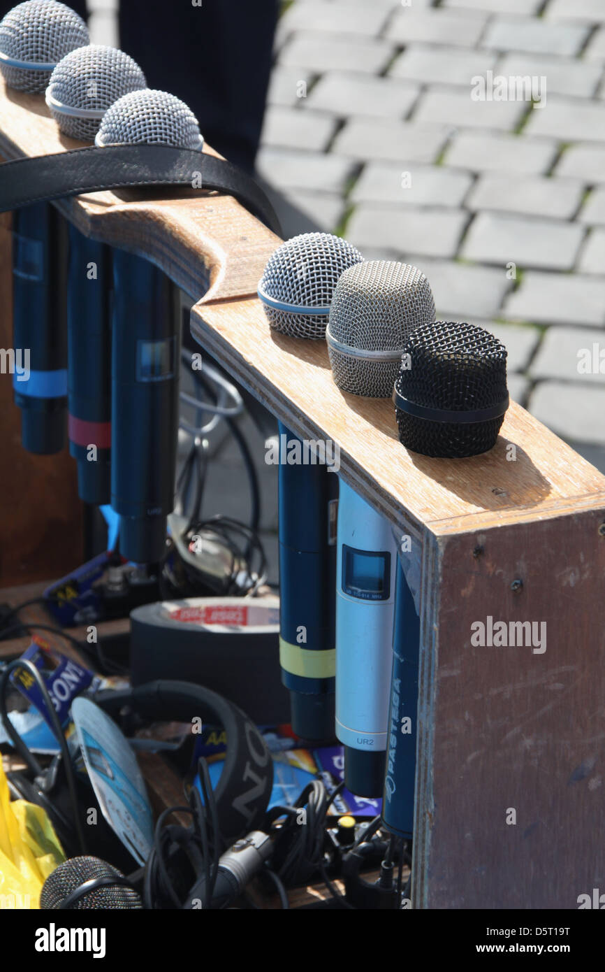 set of microphones on a stand at event Stock Photo - Alamy