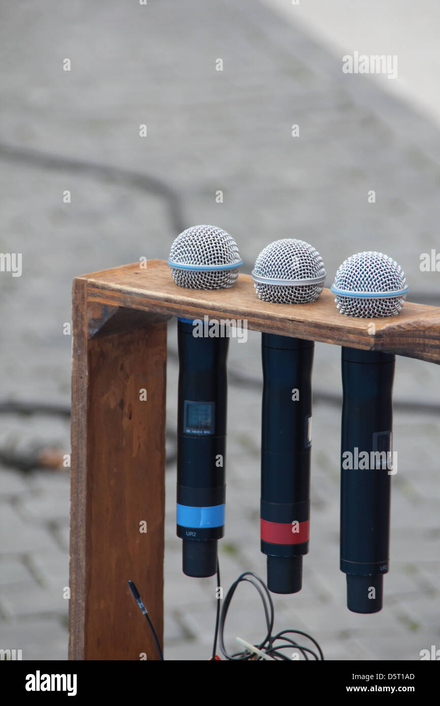 set of microphones on a stand at event Stock Photo - Alamy