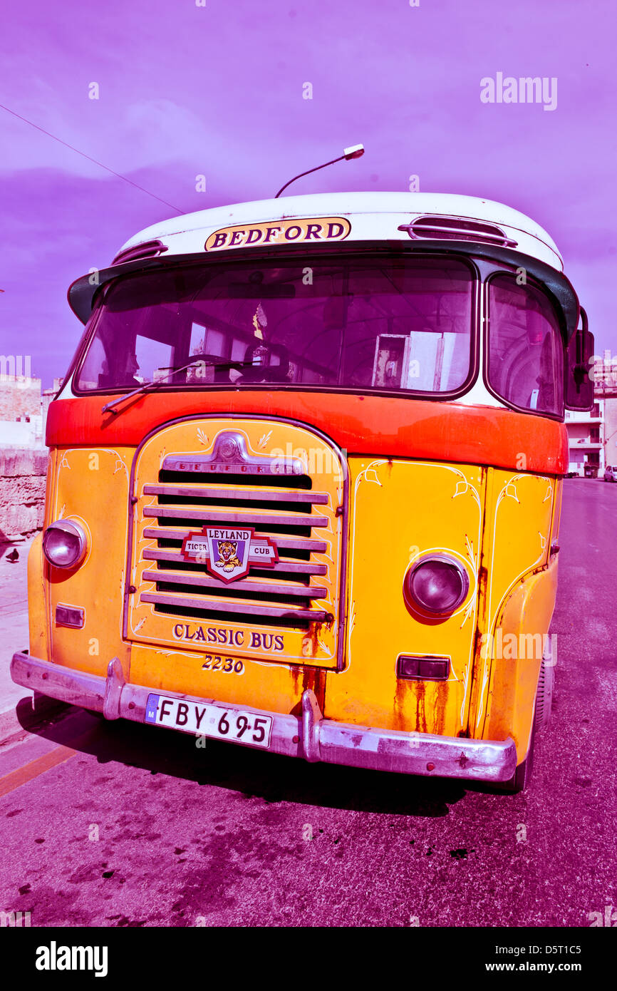 Local iconic yellow bus, Malta Stock Photo - Alamy