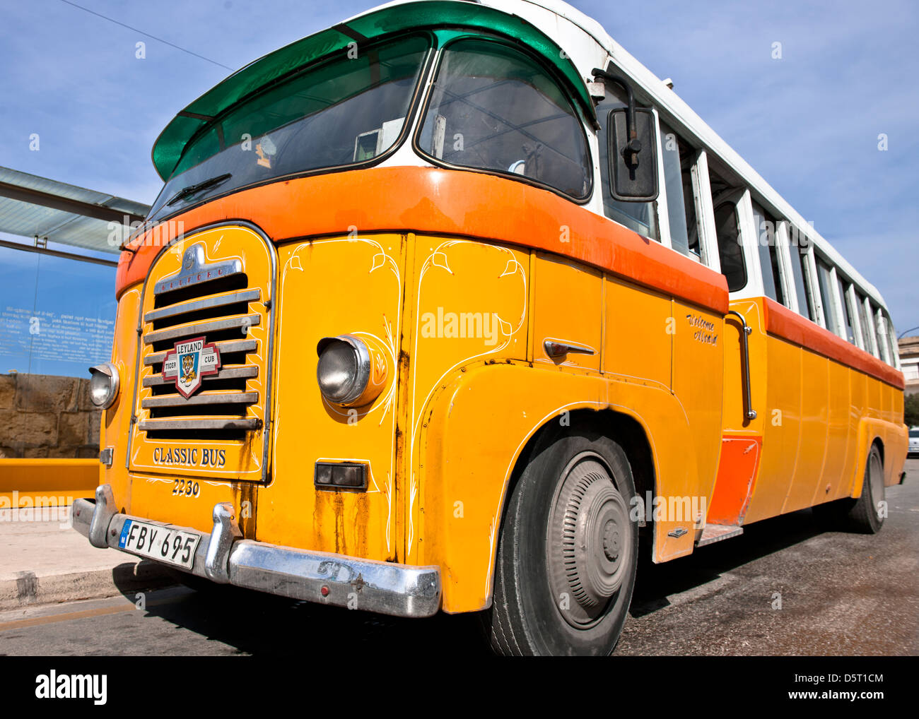 Local iconic yellow bus, Malta Stock Photo - Alamy