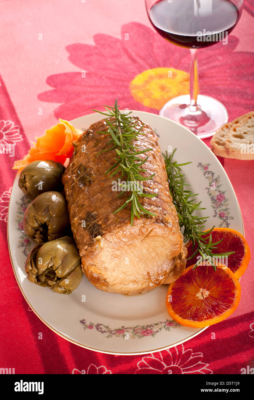 Roulade of pork on white background Stock Photo - Alamy