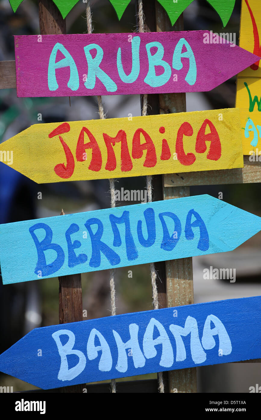 colorful signs pointing to various Caribbean tropical islands Stock ...