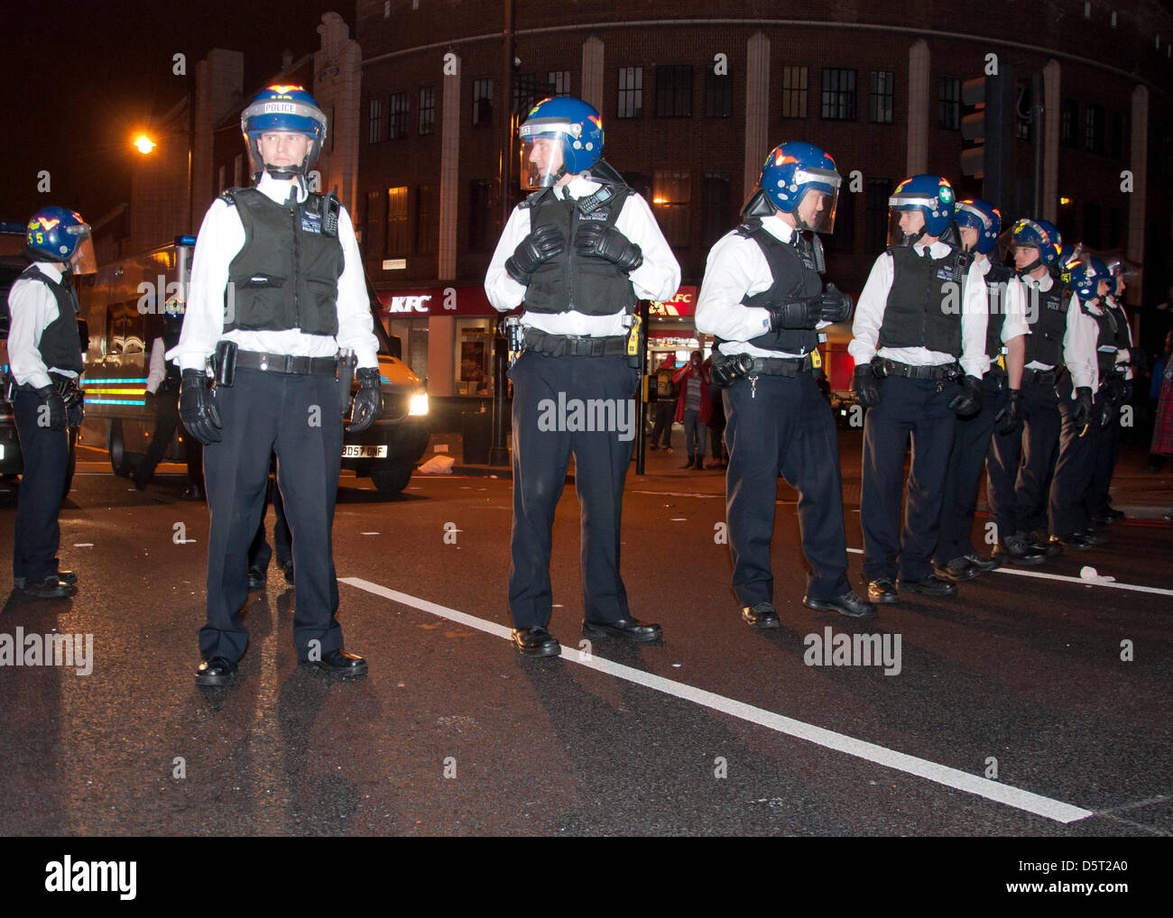 London, UK. 8th April 2013. Police turn up wearing riot gear as ...