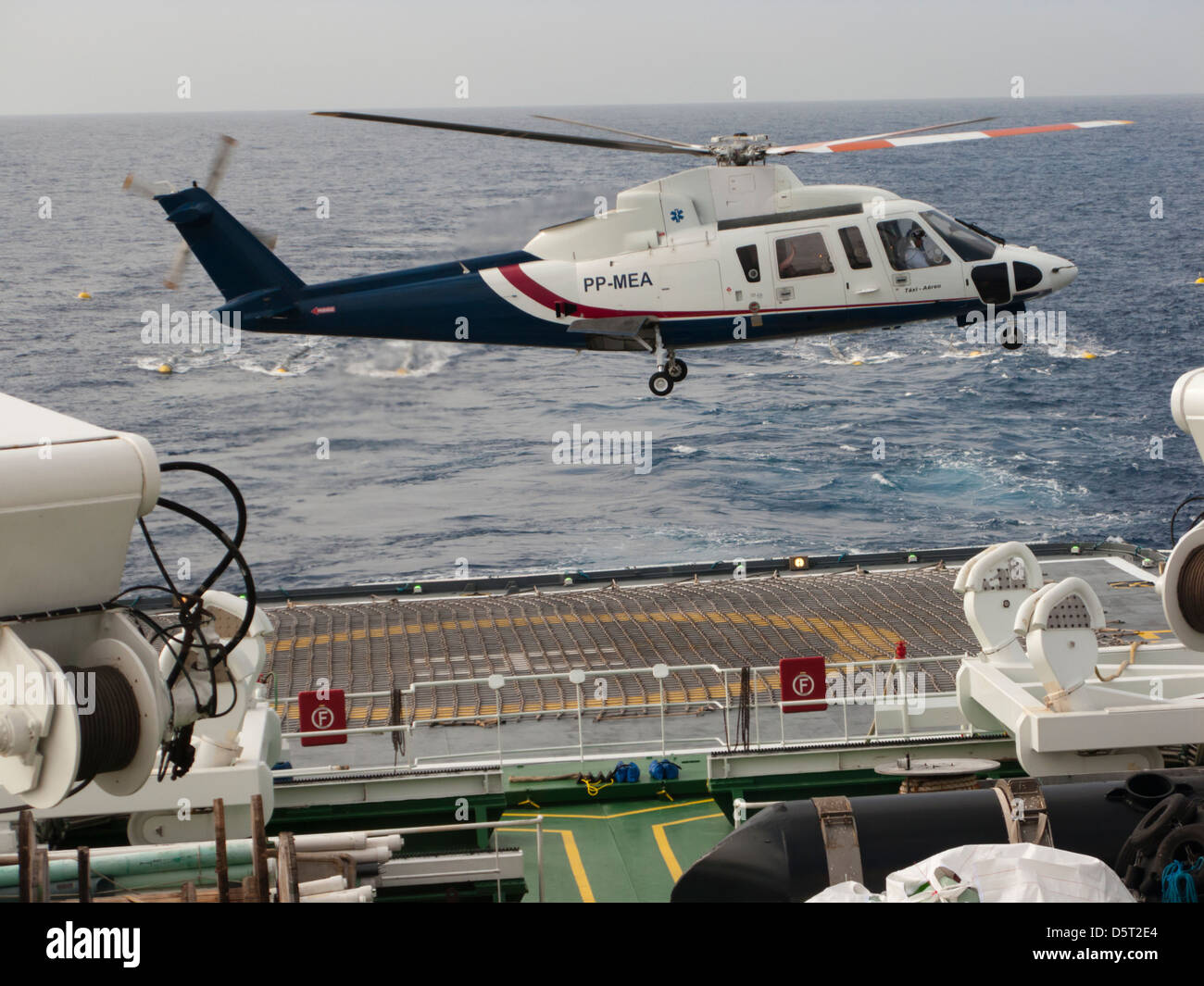 Helicopter landing in the landing deck of the offshore seismic vessel ...