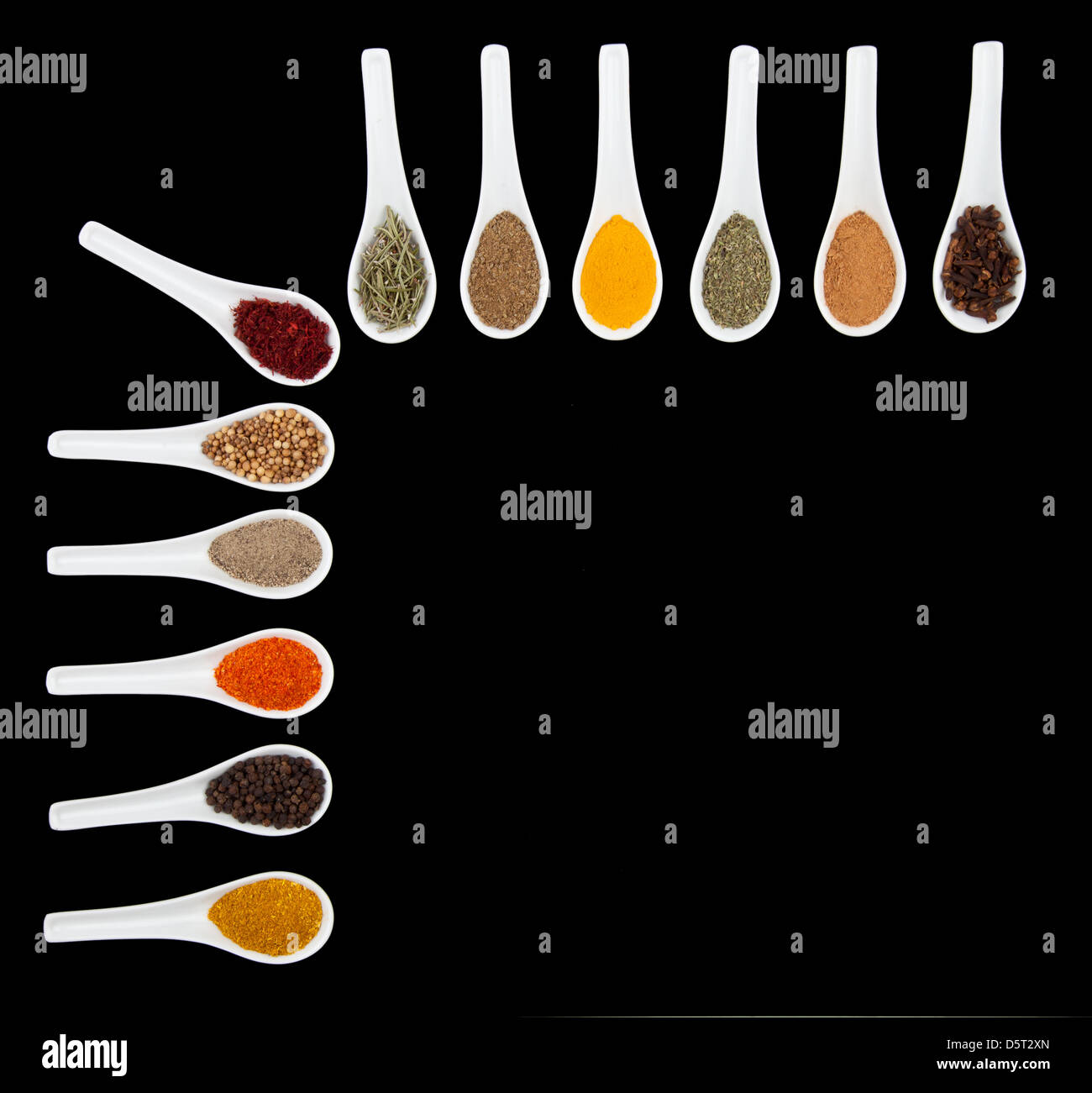 Twelve spices on black background Stock Photo - Alamy
