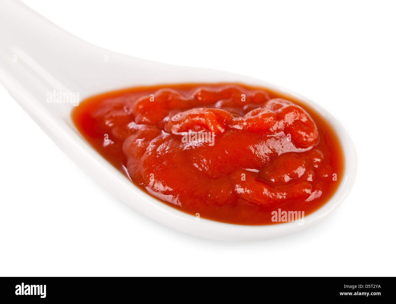 Ketchup in white ceramic spoon Stock Photo - Alamy