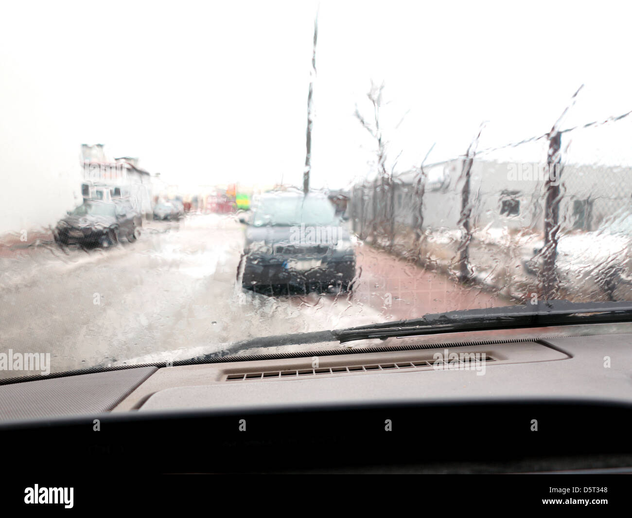Driving a car in the rain front window with windscreen wiper Stock ...