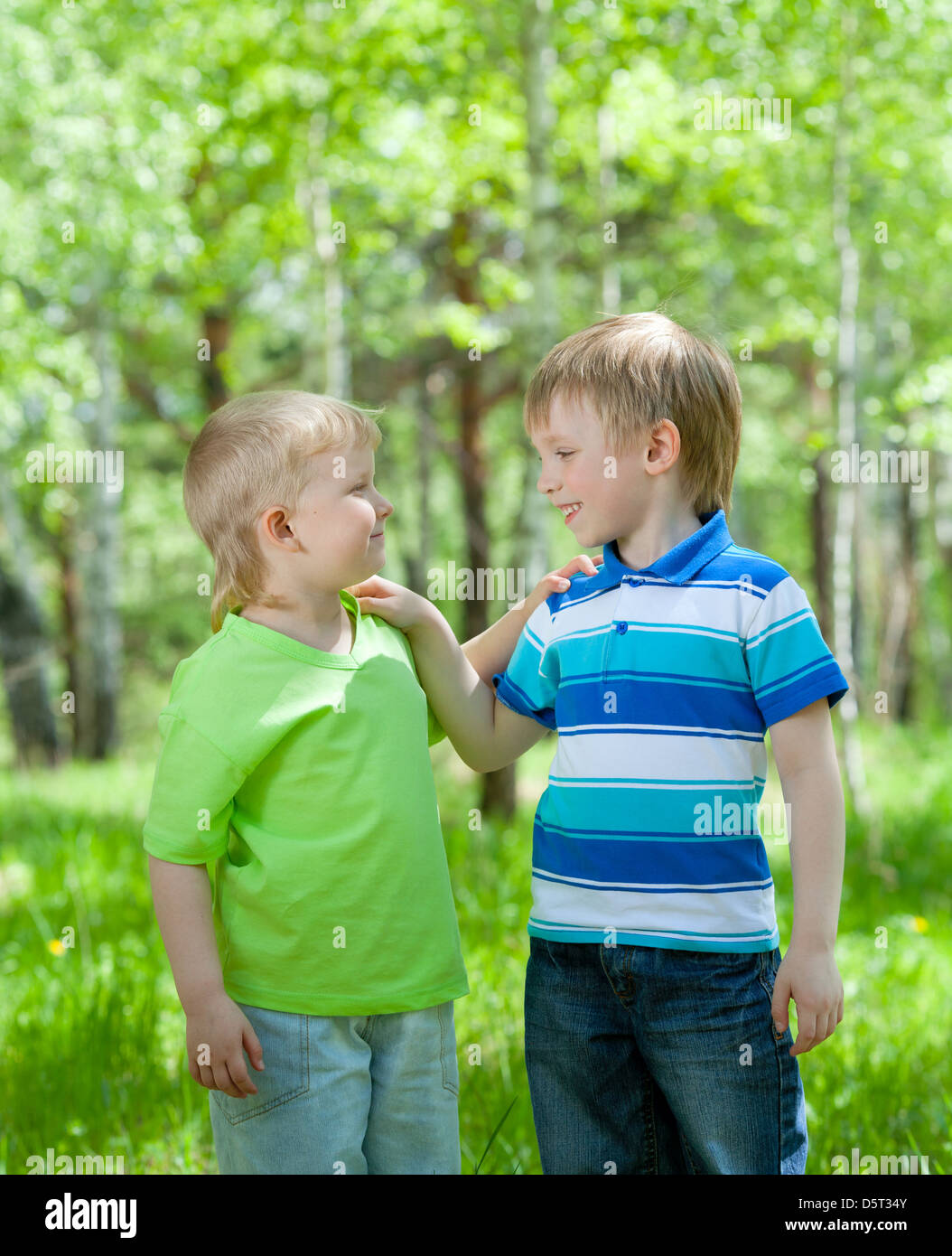 Two adorable boys standing hi-res stock photography and images - Alamy