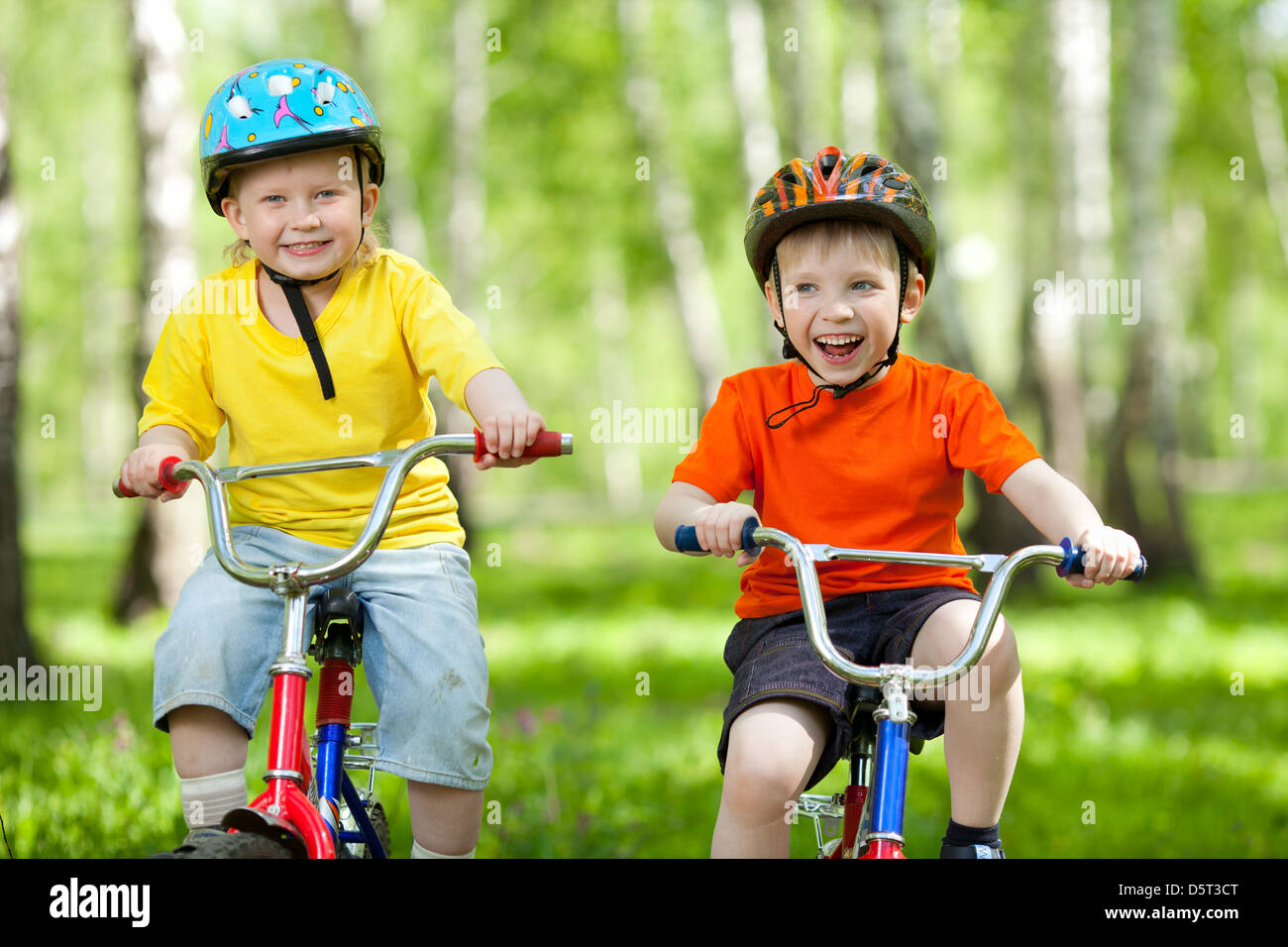 Children playing with bicycle hi-res stock photography and images - Alamy