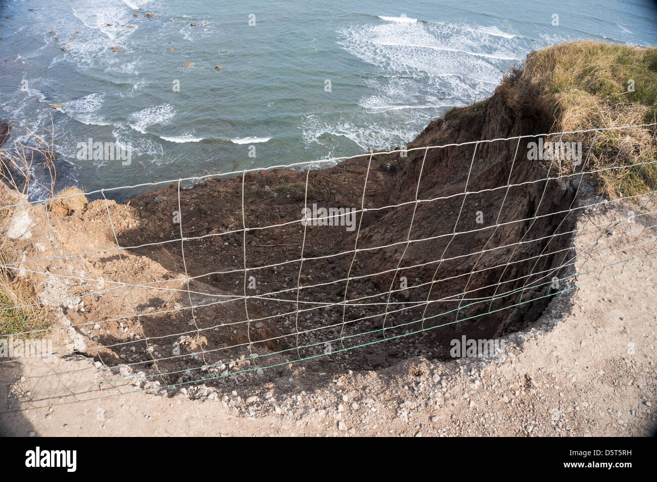 View showing severe erosion of the coastal path or Cleveland way ...