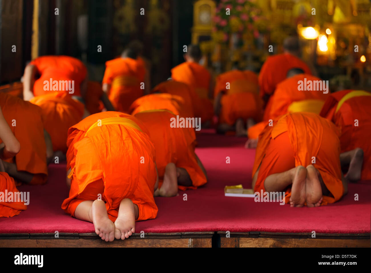 Thai Buddhist monks praying in the temple of Wang Lang district ...