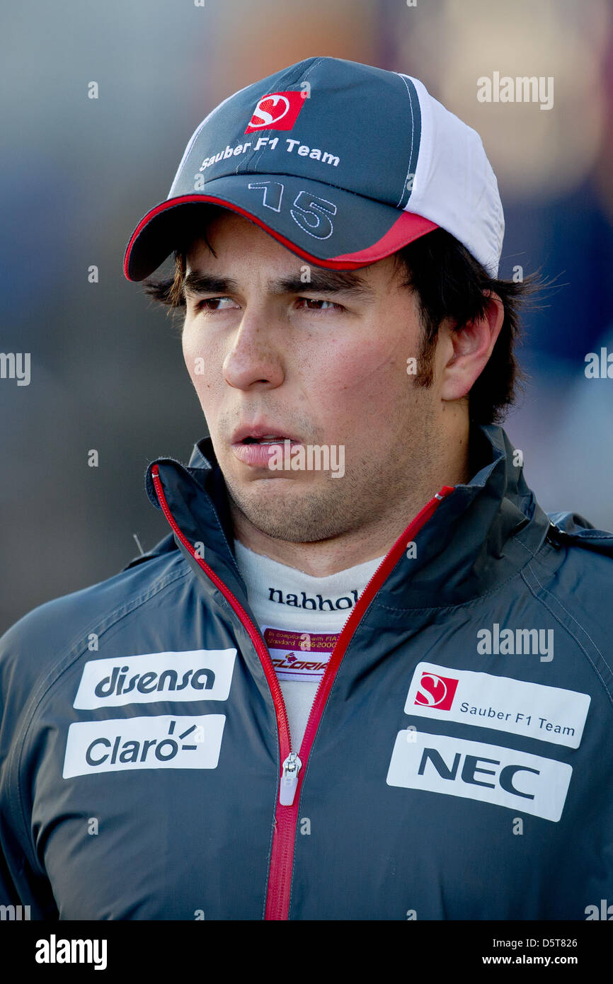 Mexican Formula One driver Sergio Perez of Sauber walks through the ...