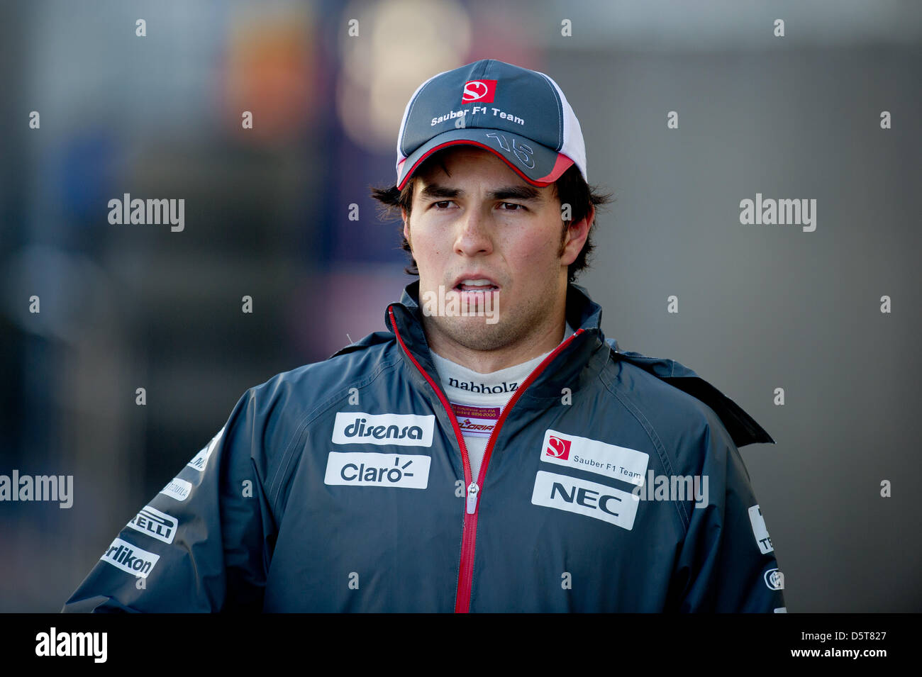 Mexican Formula One driver Sergio Perez of Sauber walks through the ...