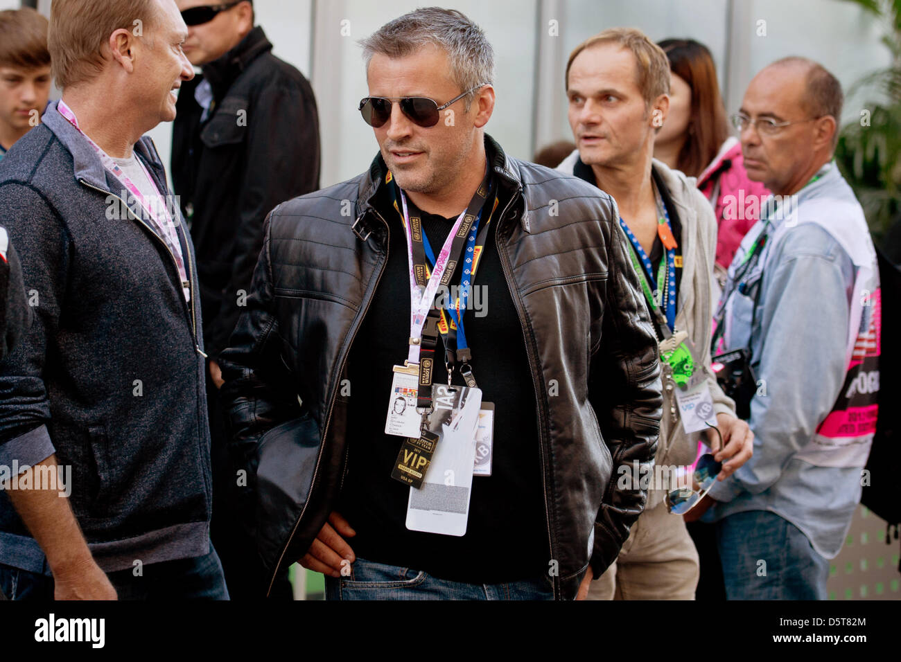 US Actor Matthew Steven "Matt" LeBlanc (C) walks through the paddock at ...