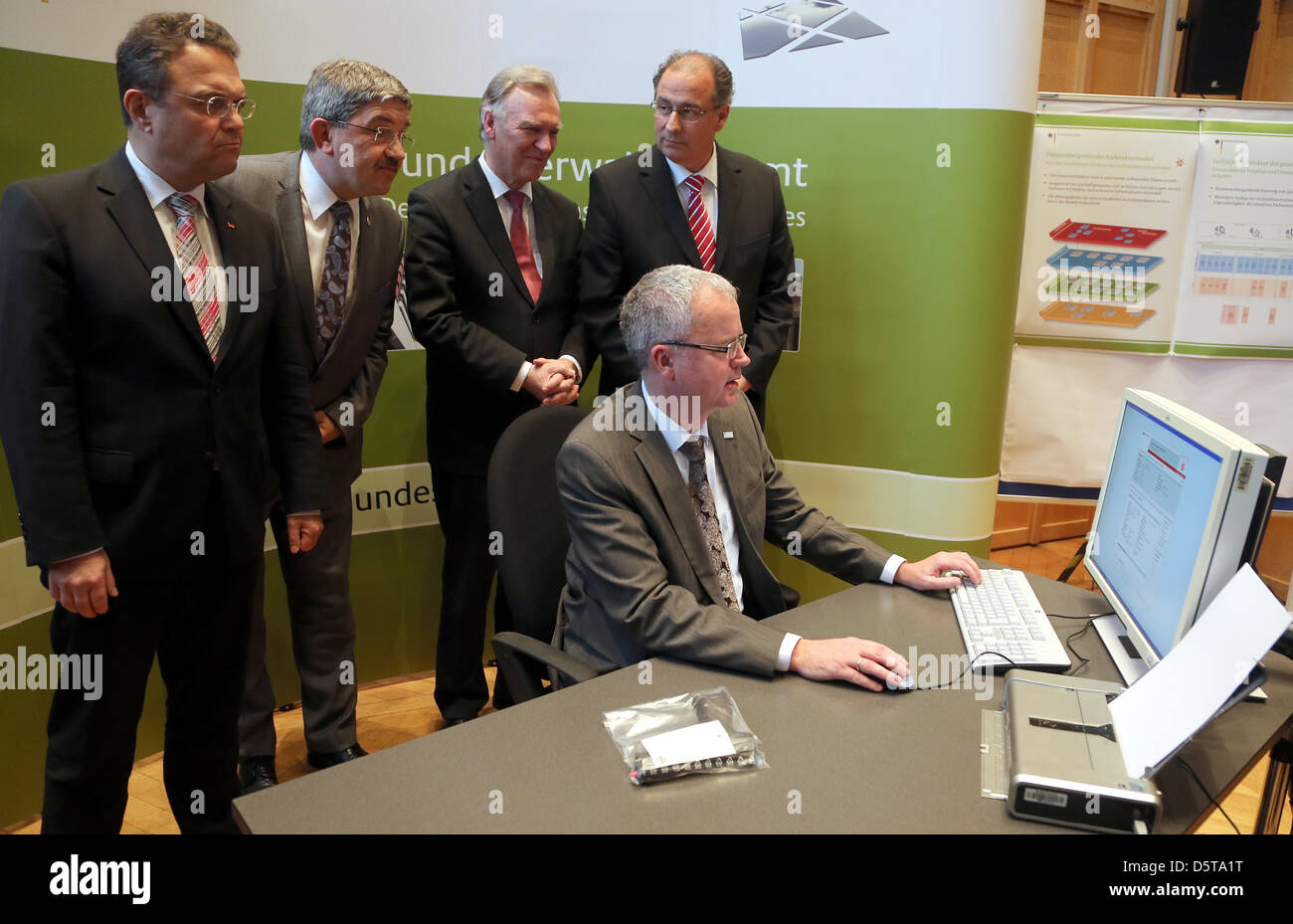 An employee of the German Federal Administration Office demonstrates ...