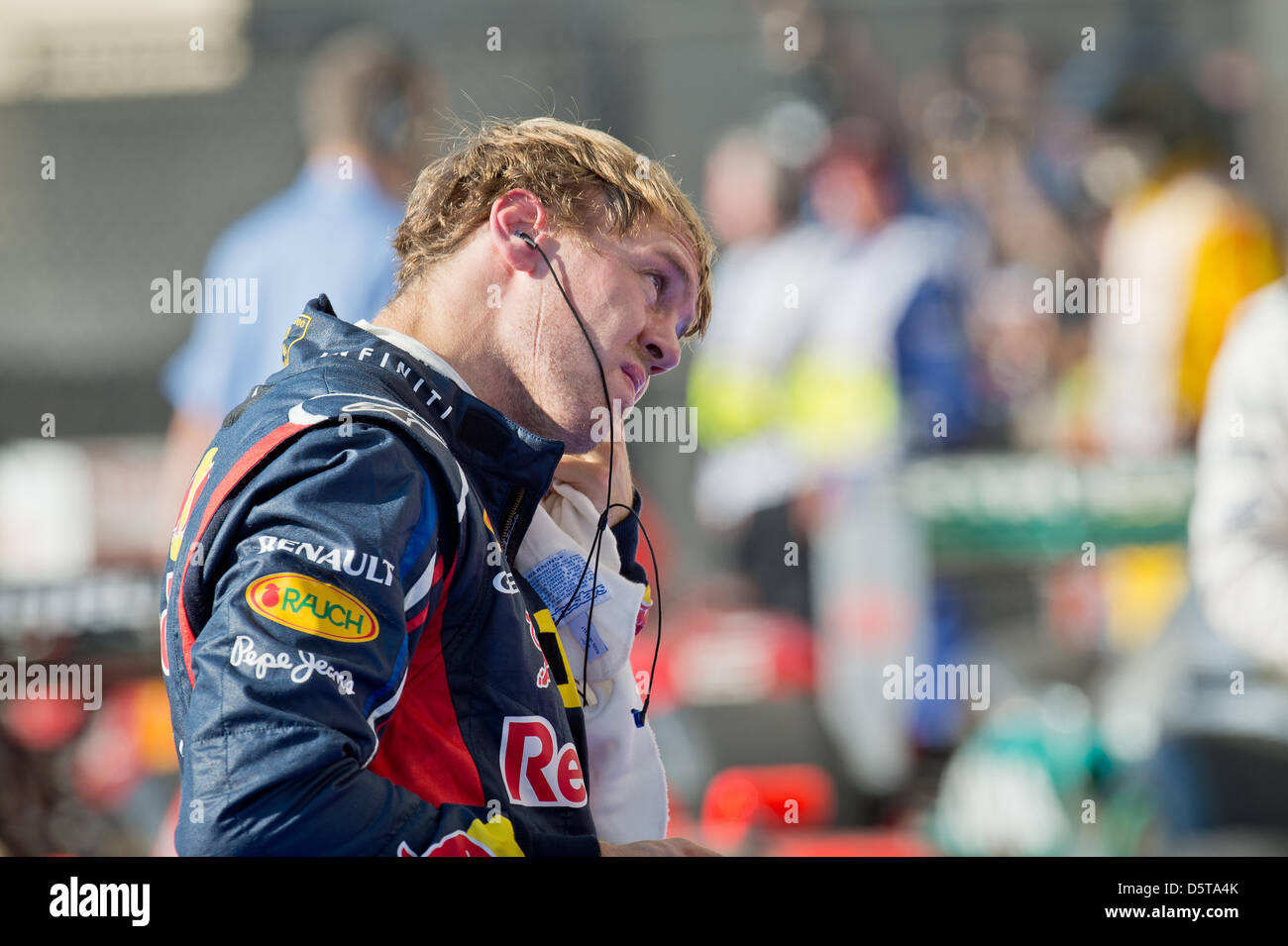 German Formula One driver Sebastian Vettel of Red Bull walks through ...