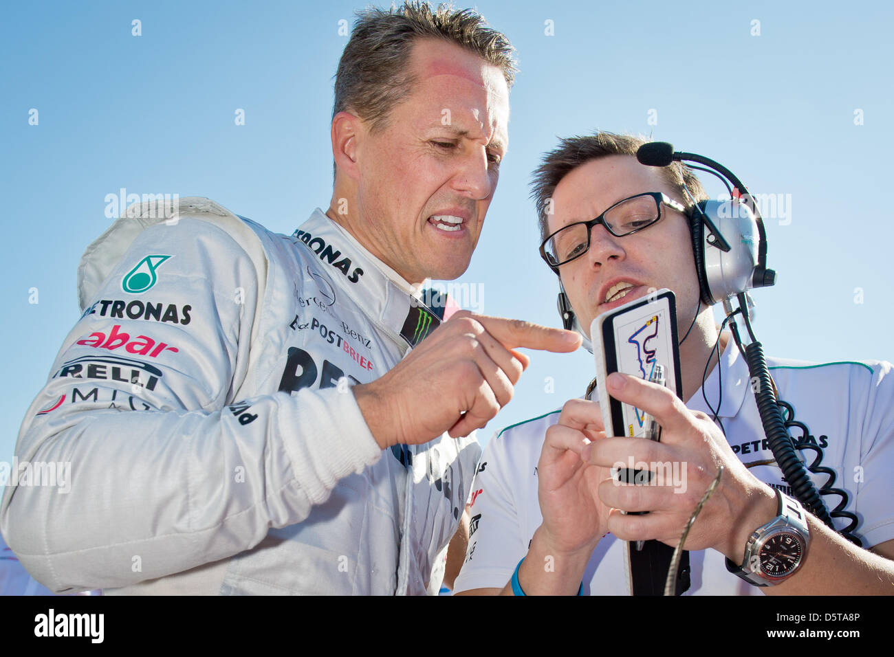 German Formula One driver Michael Schumacher (L) of Mercedes AMG talks ...