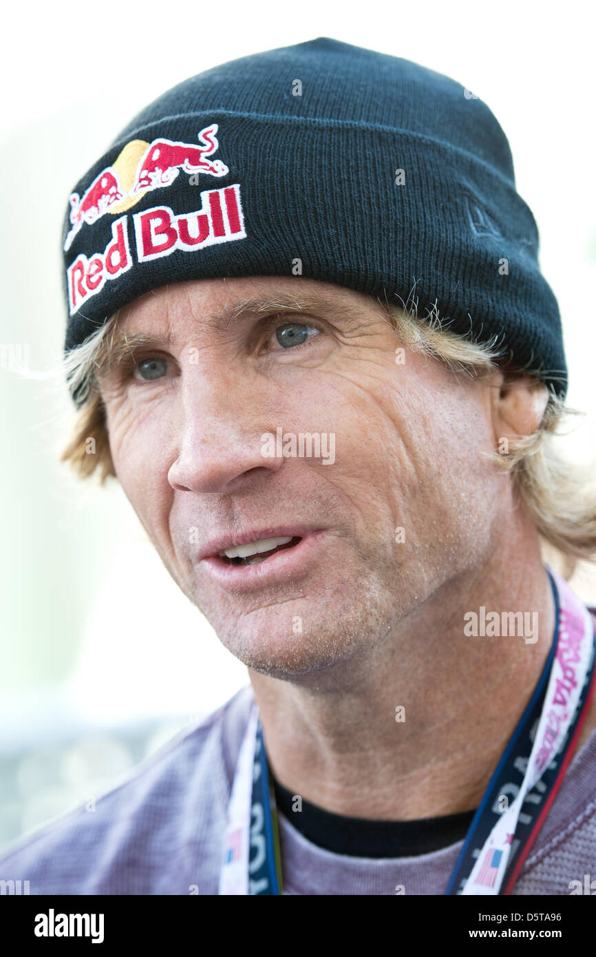 Surf legend Robby Naish has a chat in the paddock before the start of ...