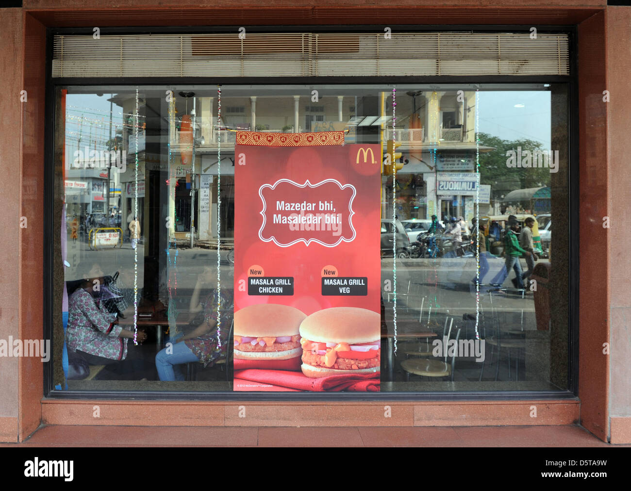 A poster advertisting a Masala Grill Chicken Burger and a Masala Veggie ...