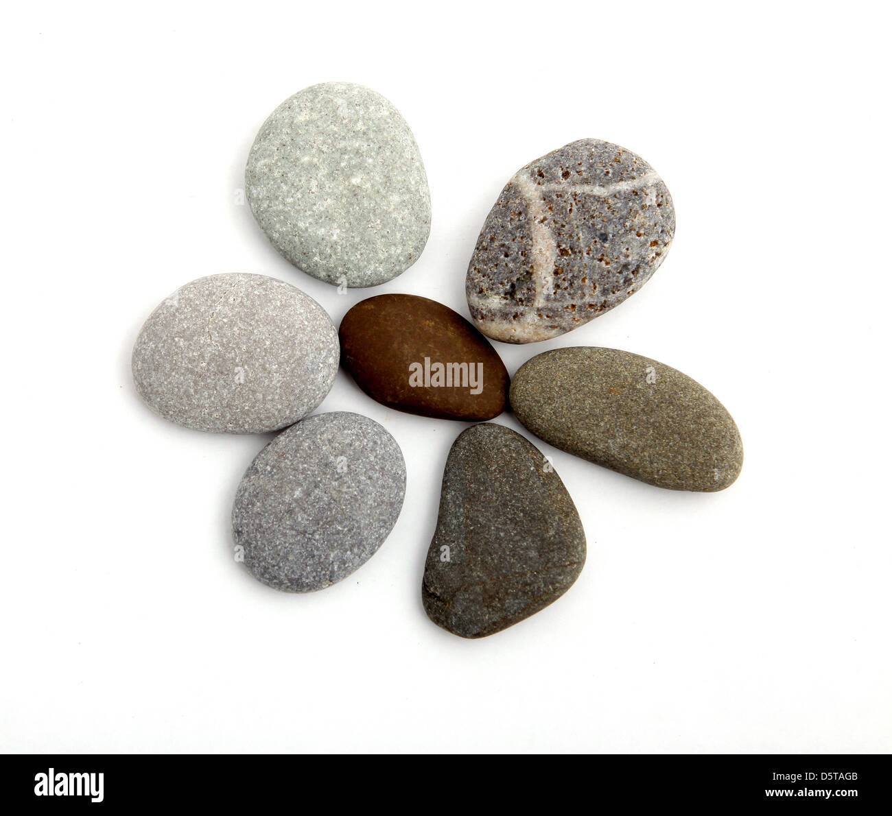 Pebble sun isolated on white Stock Photo - Alamy