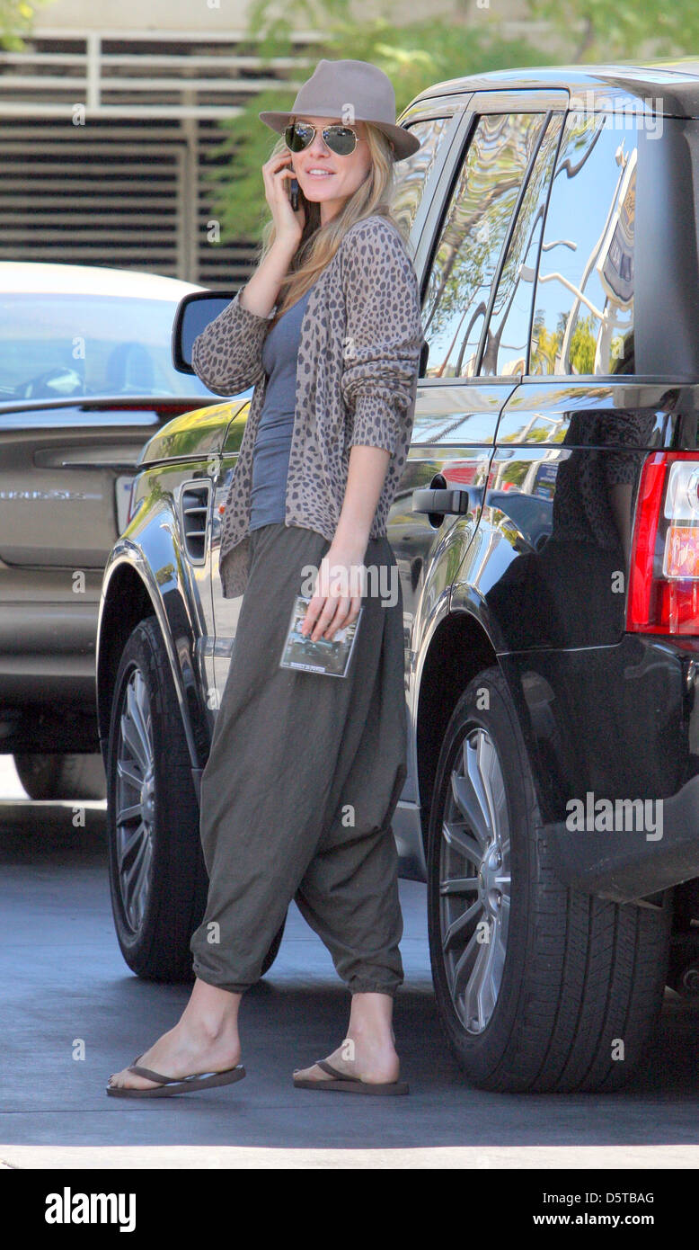 Monet Mazur buys a CD from a musician at a gas station in Los Feliz Los ...
