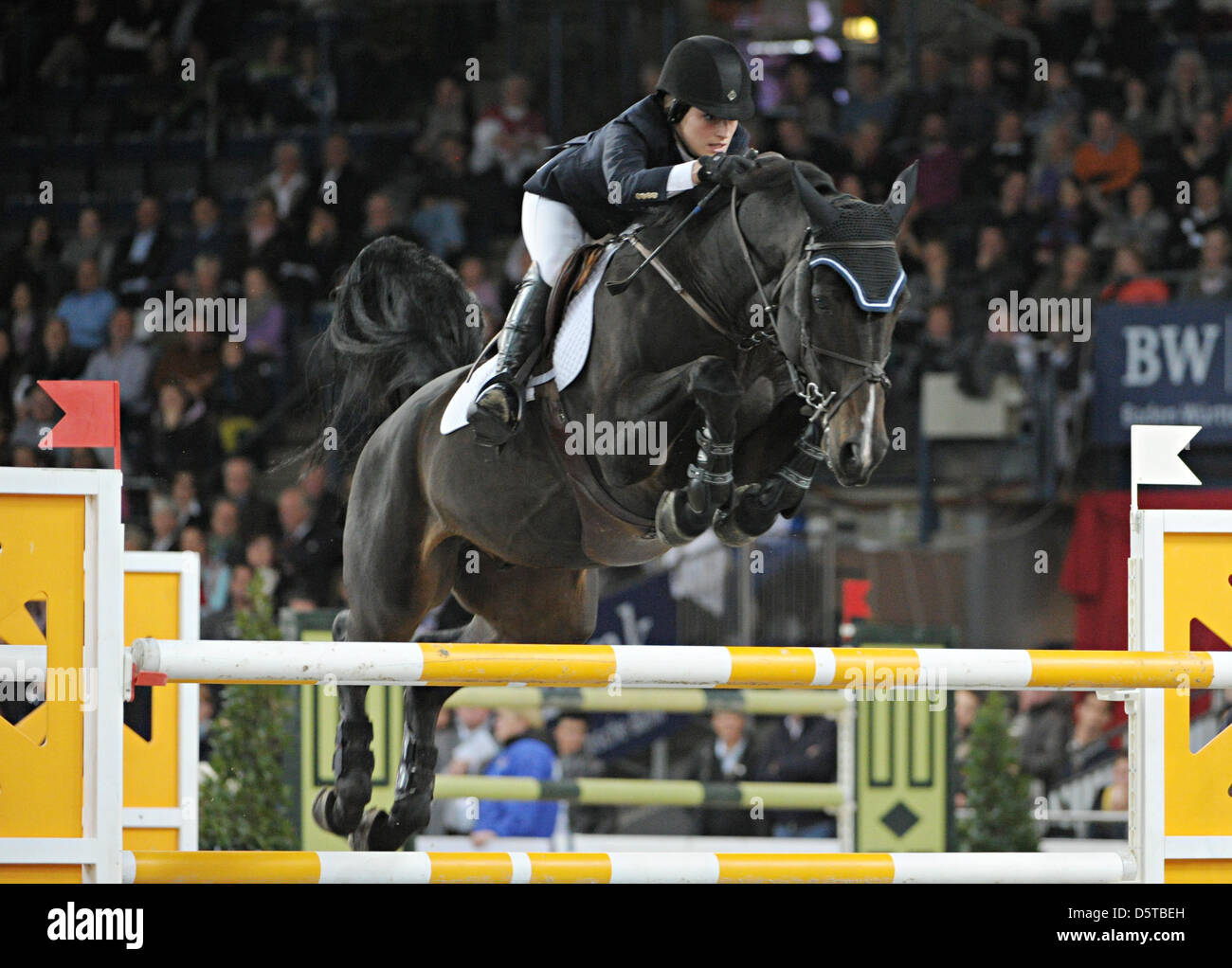 American show jumper Jessica Springsteen jumps a hurdle on her horse ...