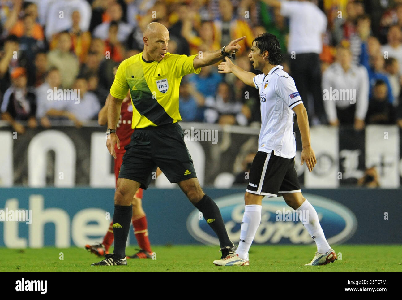 Referee Howard Webb gestures during the Champions League Group F soccer ...