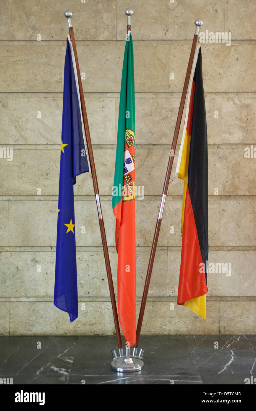 A European, a Portuguese and a German flag are pictured at the German ...