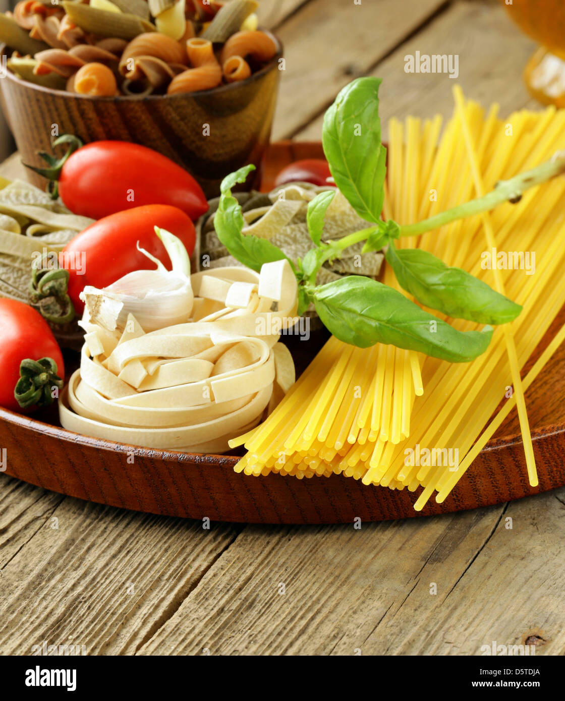 Various types of pasta (spaghetti, fettuccini, penne) and tomato Stock ...