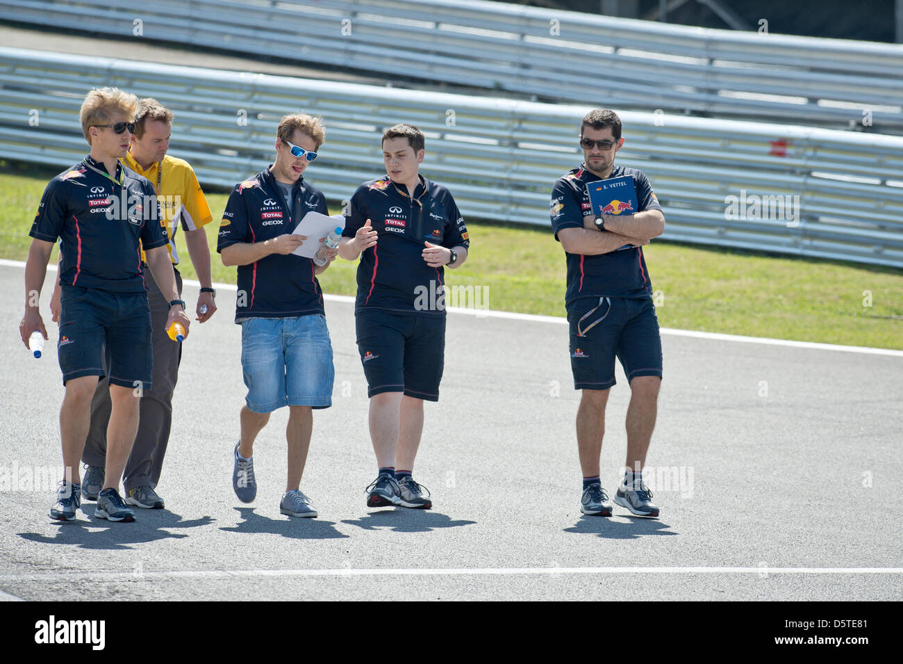 German Formula One driver Sebastian Vettel (C) of Red Bull, his fitness ...