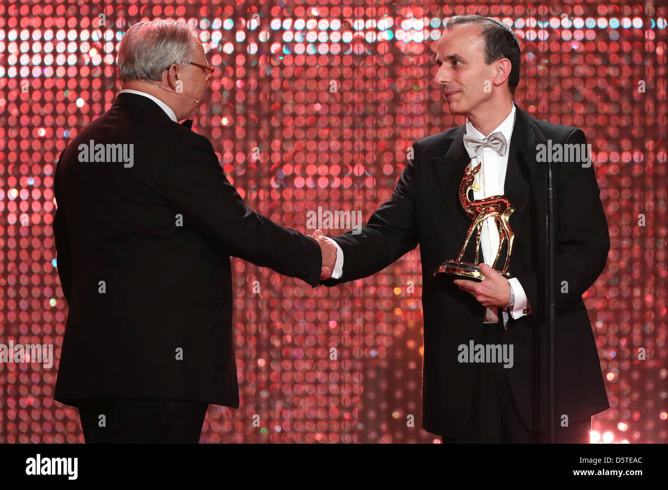 Rabbi Daniel Alter (r) of Berlin speaks on stage with the Bambi trophy ...