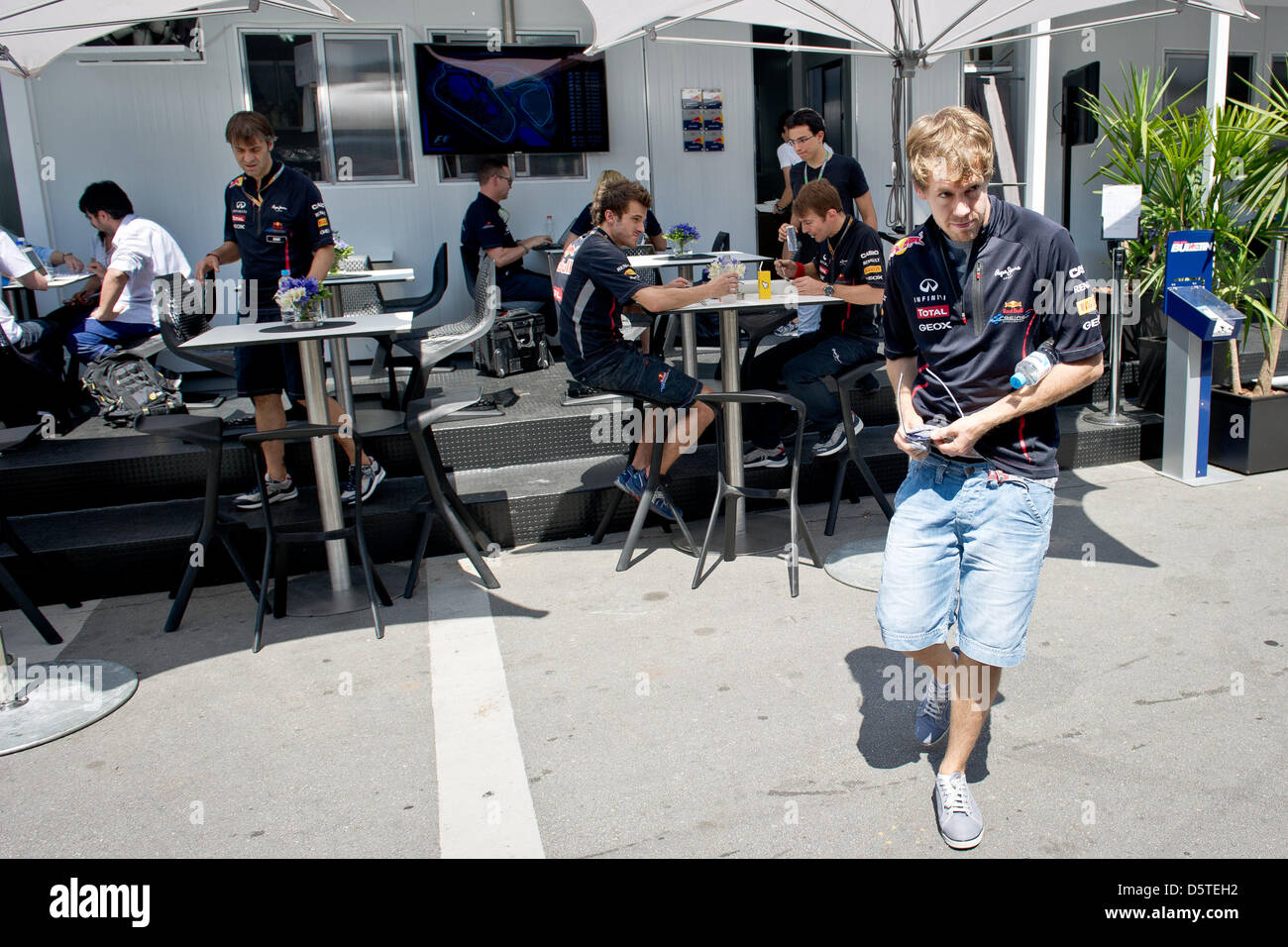 German Formula One driver Sebastian Vettel of Red Bull walks through ...