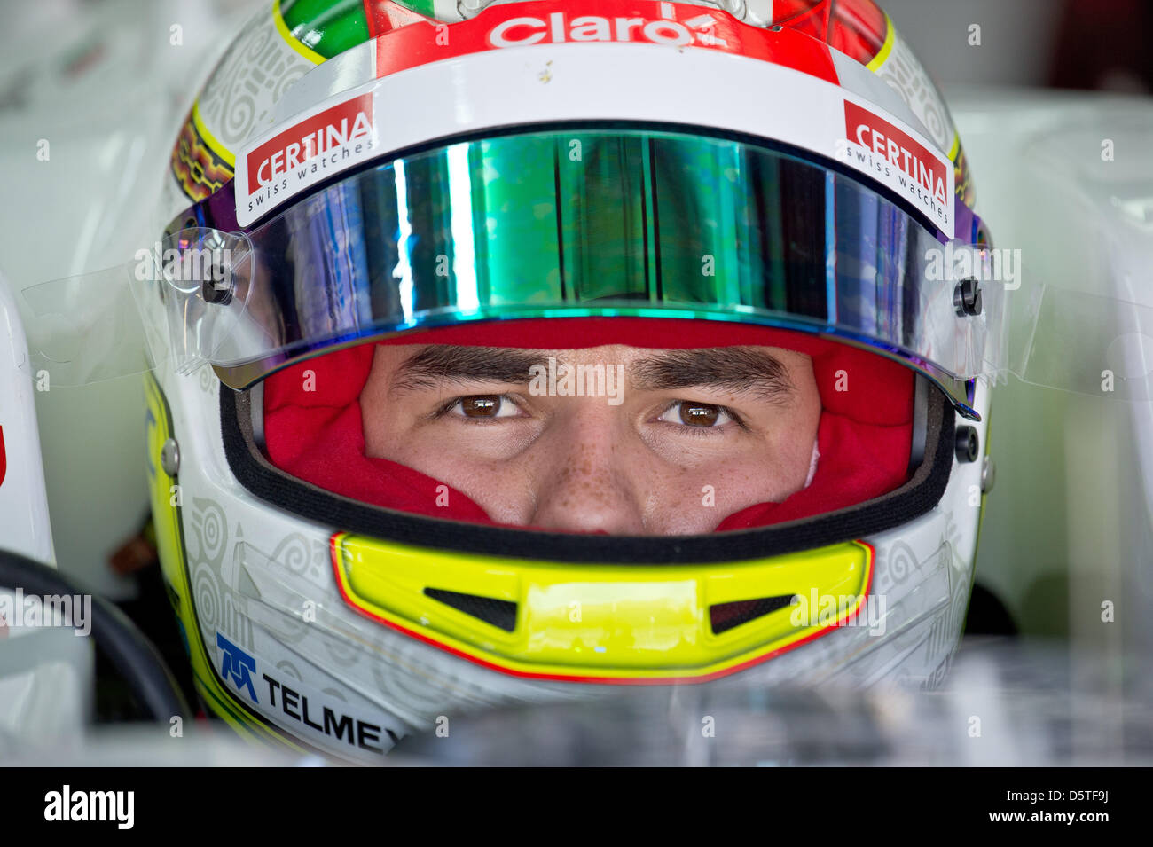 Mexican Formula One driver Sergio Perez of Sauber sits in his car ...