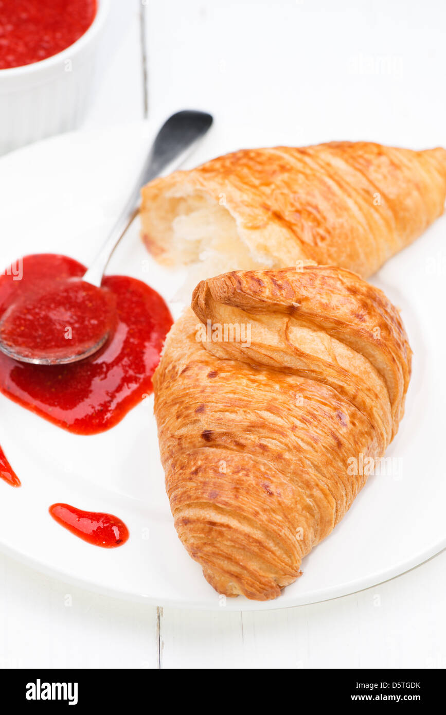 Croissant and strawberry jam and spoon Stock Photo - Alamy