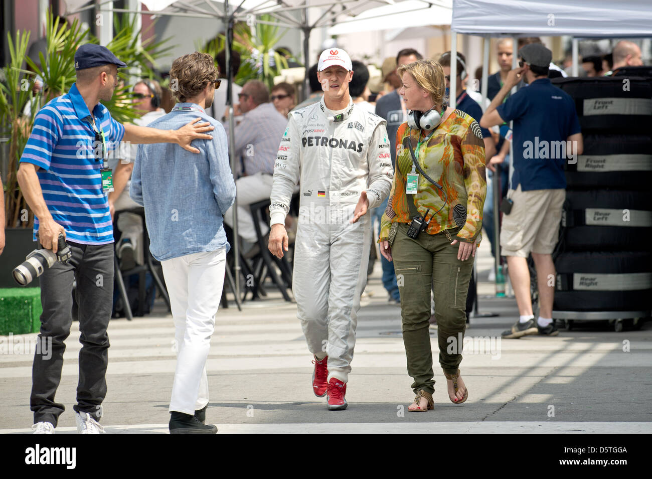 German Formula One driver Michael Schumacher (C) of Mercedes AMG and ...
