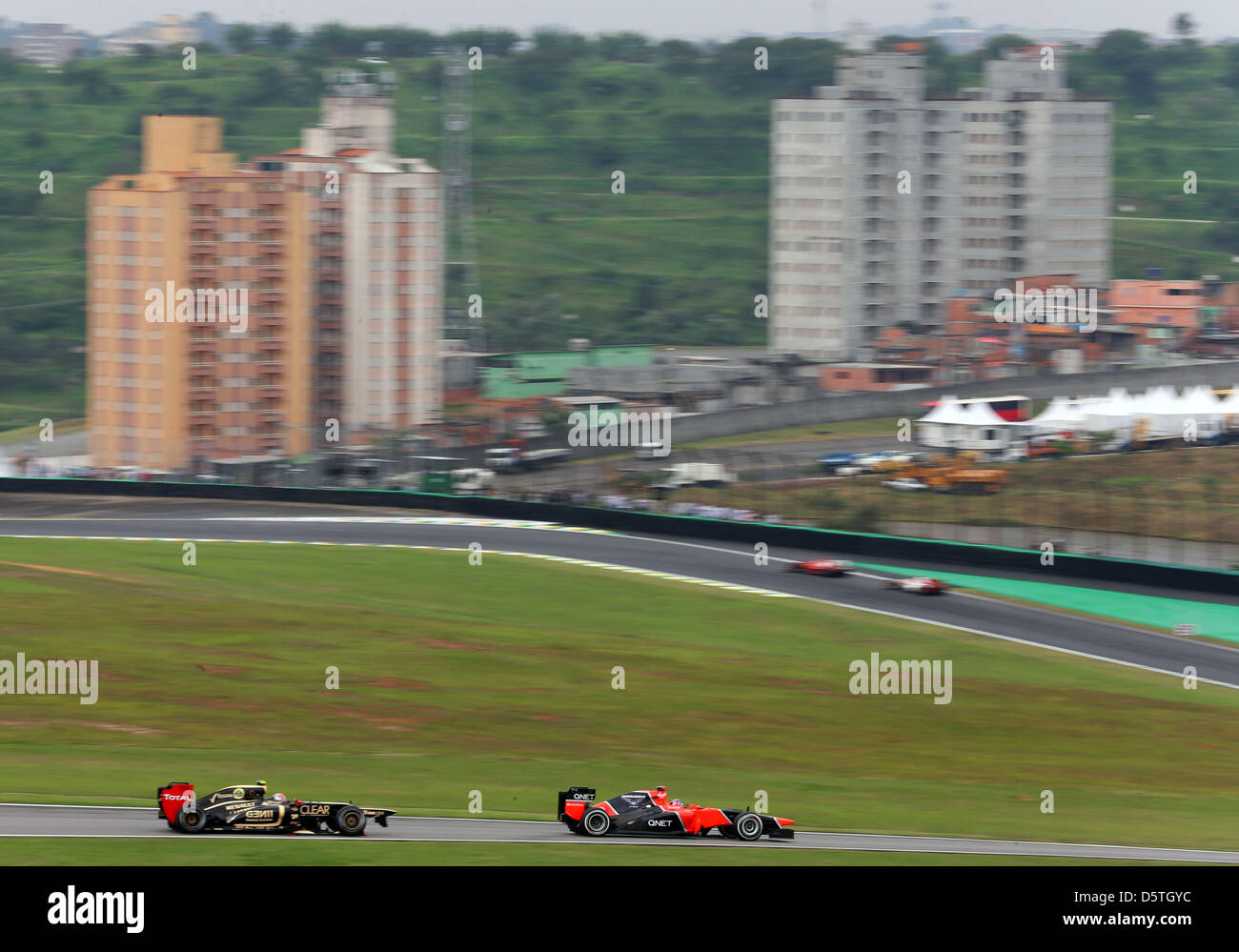 German Formula One driver Timo Glock (front) of Marussia and French ...