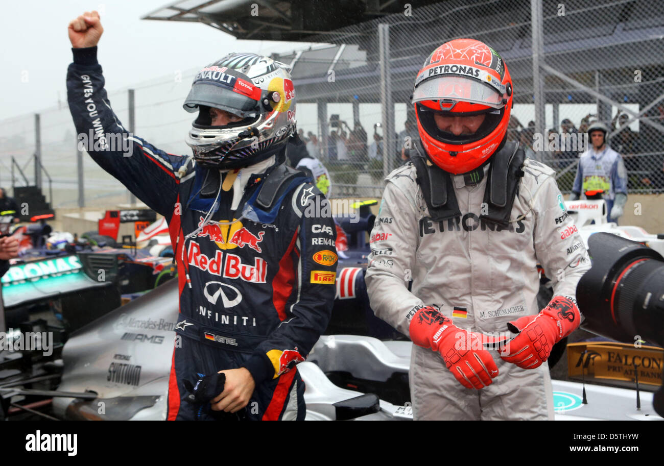 German Formula One driver Sebastian Vettel (L) of Red Bull celebrates ...