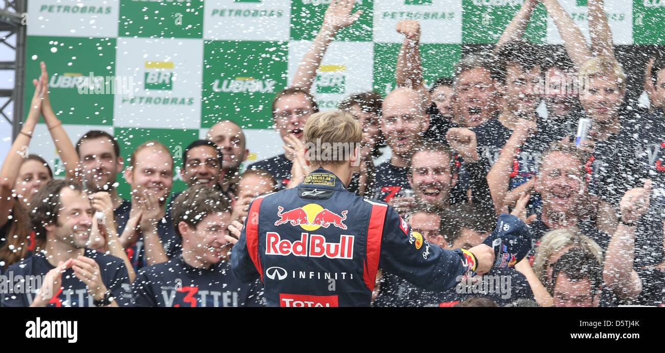 German Formula One driver Sebastian Vettel (C) of Red Bull Racing ...